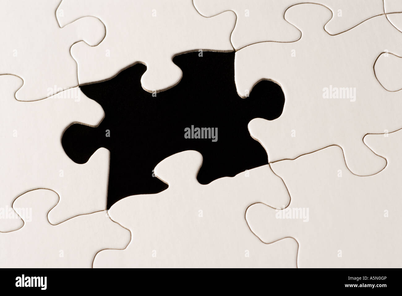 a nearly completed puzzle with a missing piece Stock Photo - Alamy