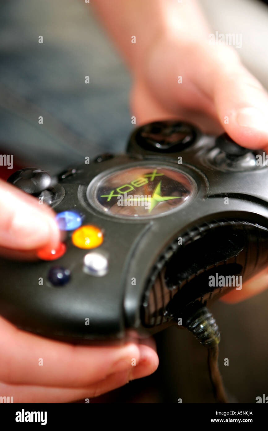 A PERSONS HANDS PLAYING A GAMES CONSOLE JOYPAD Stock Photo - Alamy