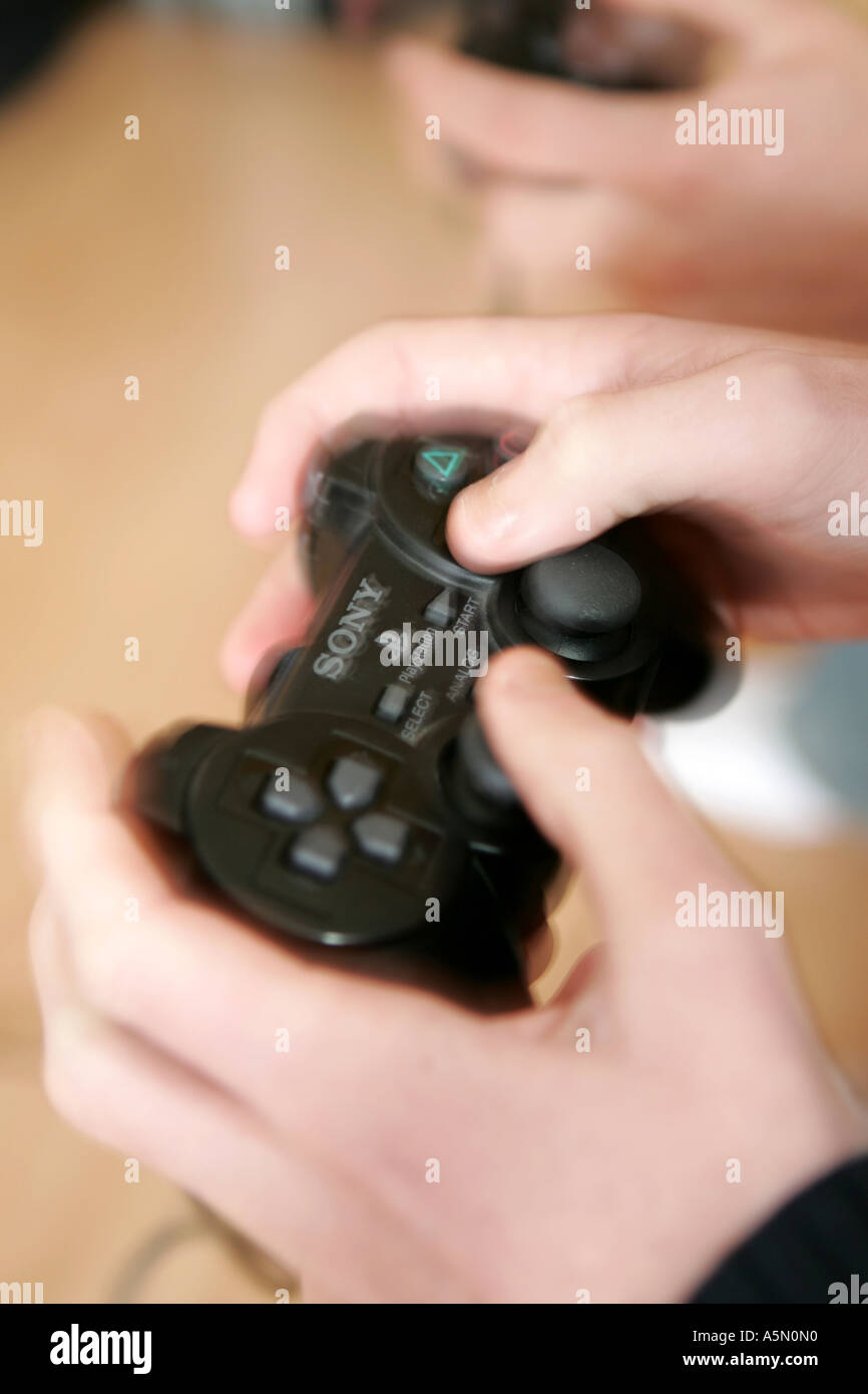 TWO PEOPLES HANDS PLAYING GAMES CONSOLE JOYPADS Stock Photo - Alamy