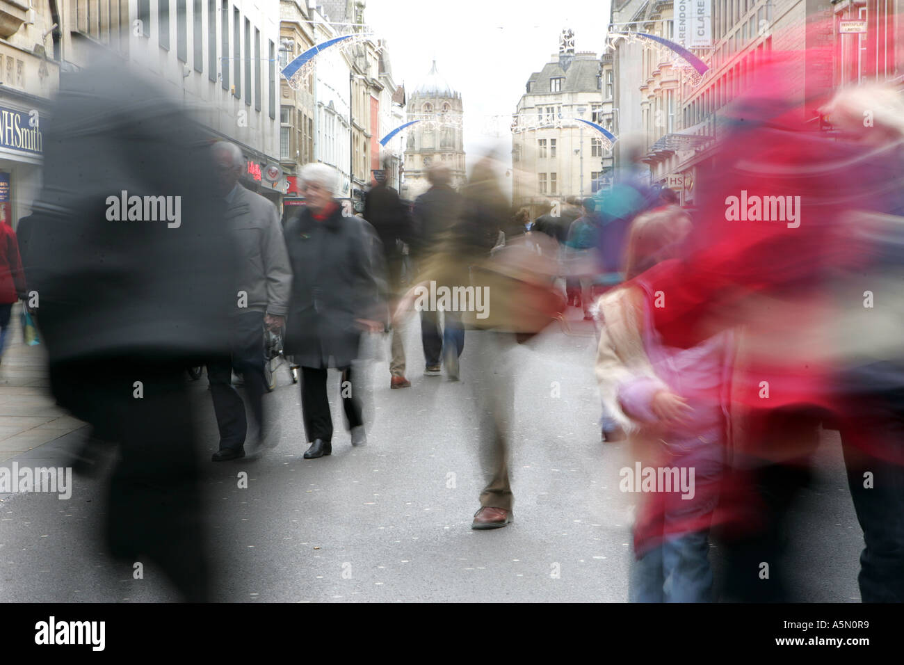 CROWD OF PEOPLE MOVING THROUGH HIGH STREET BLURRY IMAGE Stock Photo - Alamy