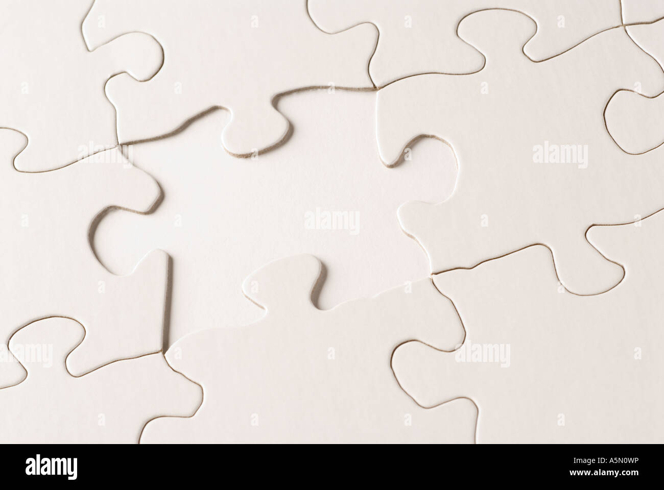 a nearly completed puzzle with a missing piece Stock Photo - Alamy