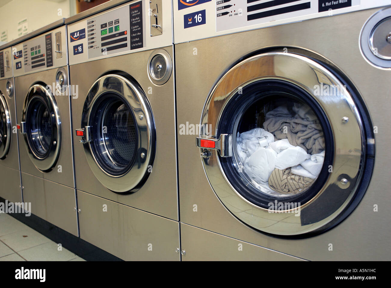 Laundrette Washing Machines Stock Photo - Alamy