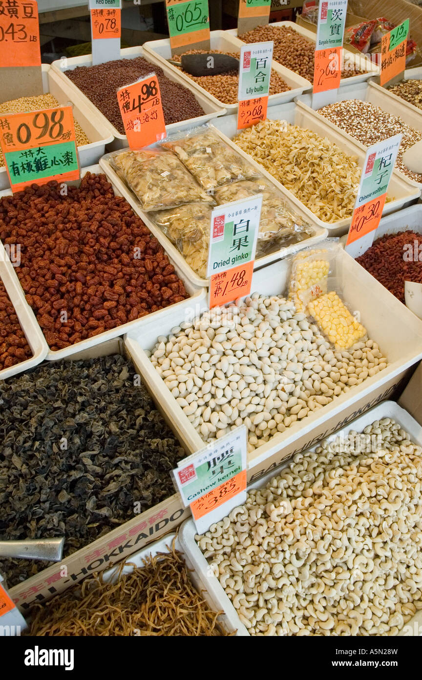 dried fish nuts fruit seeds and mushrooms in bins on the sidewalk ...