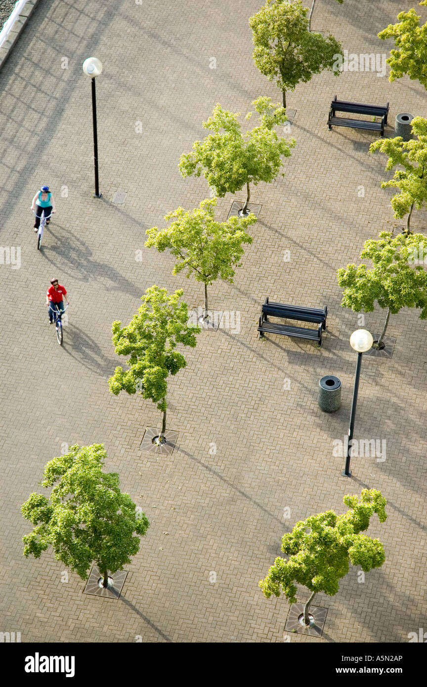 overhead view of a couple cycling through a plaza Vancouver British ...