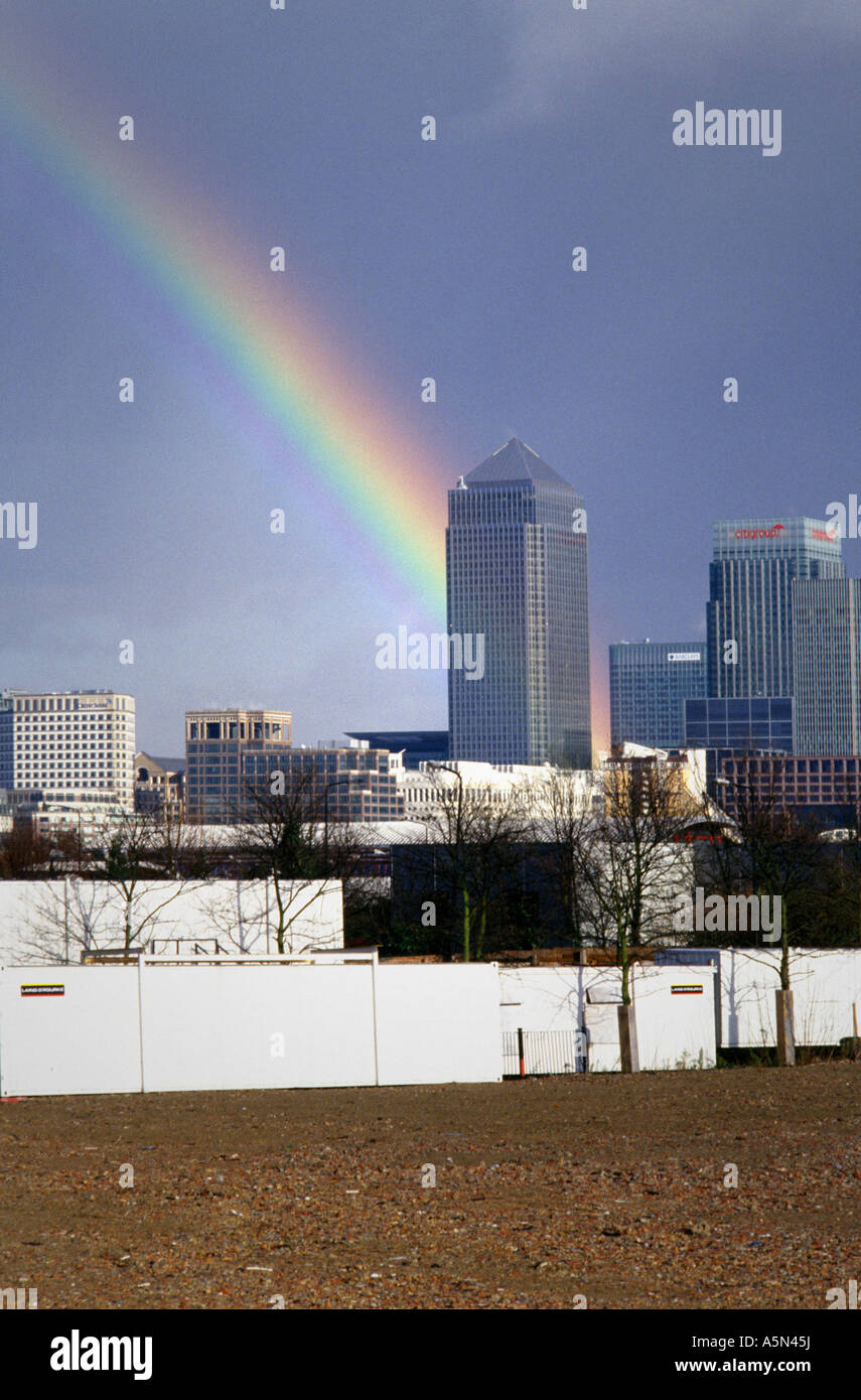 canary wharf with a rainbow going into it Stock Photo - Alamy