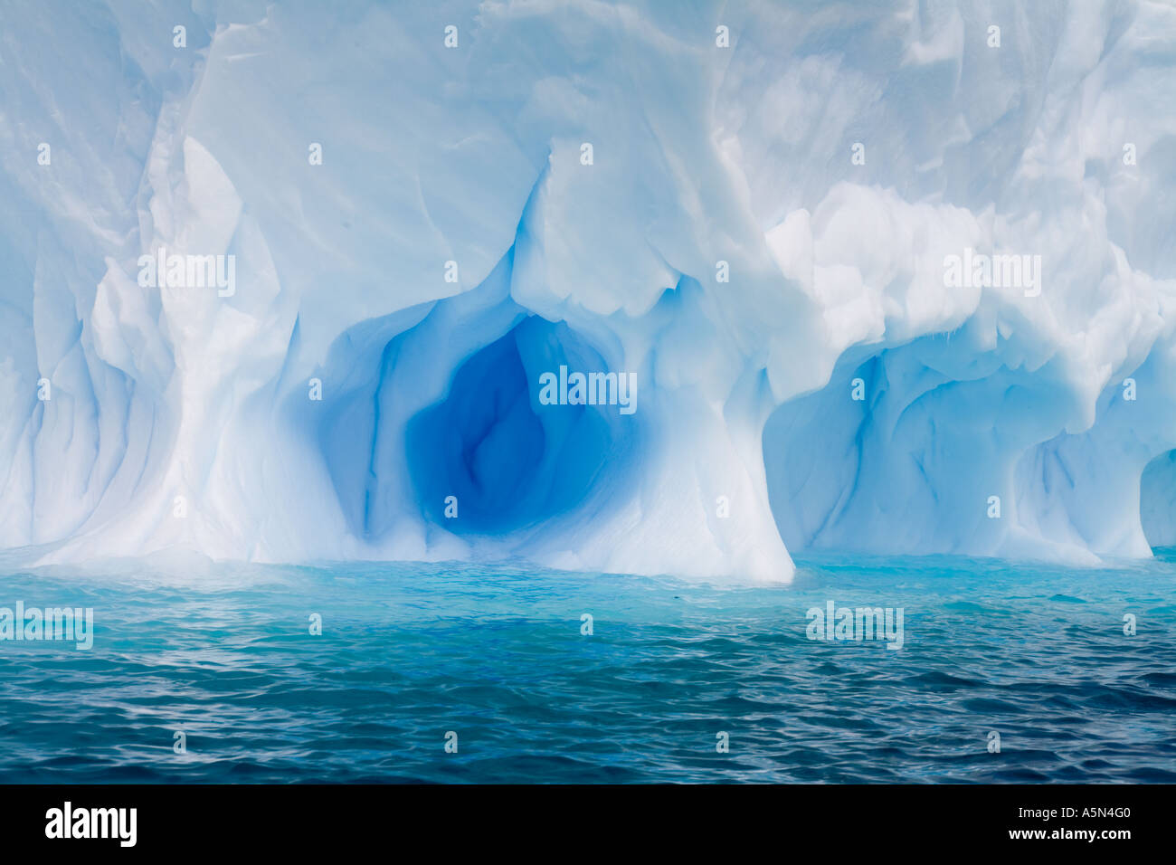 Blue iceberg cave Stock Photo - Alamy