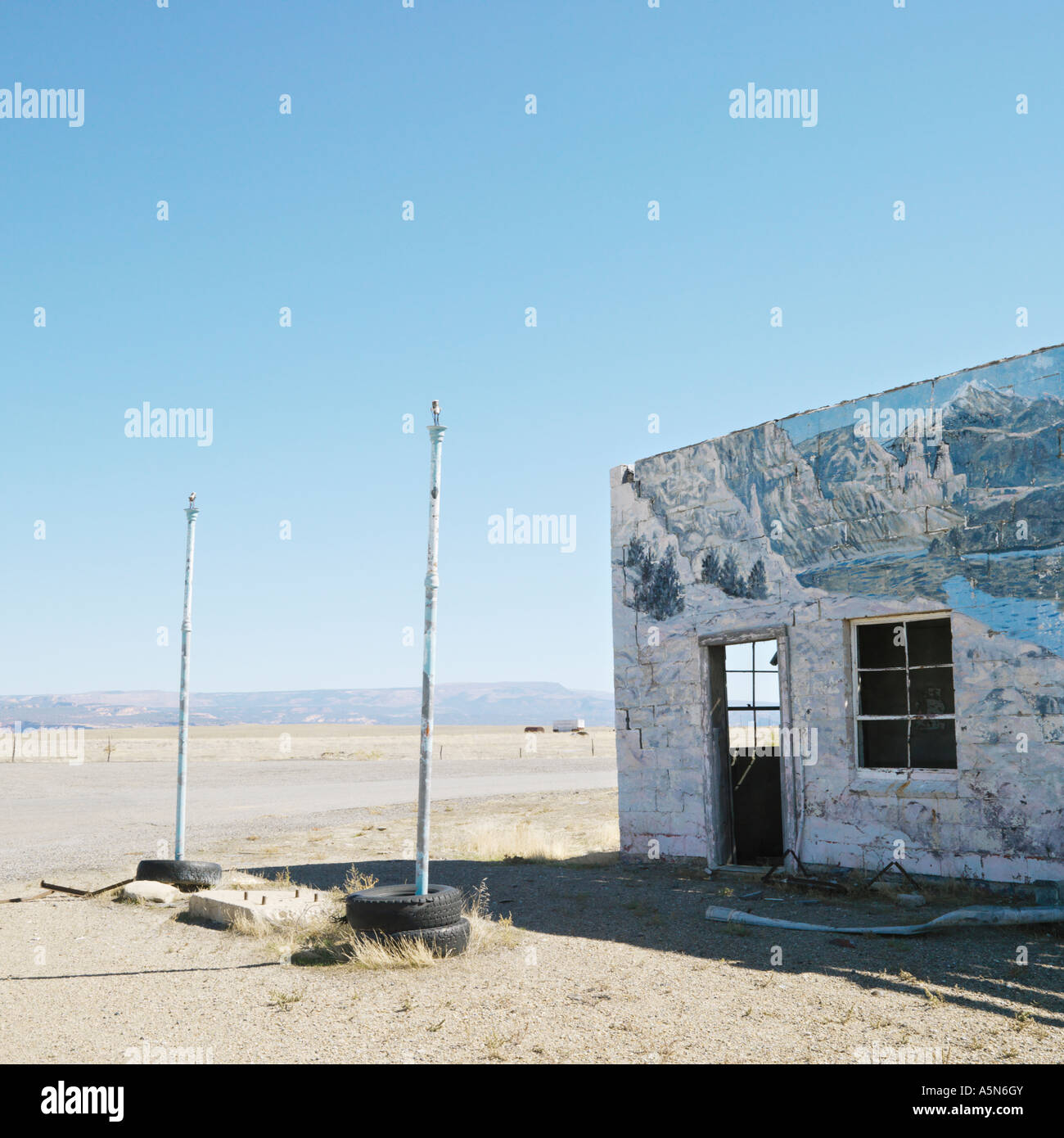 Building in barren desert landscape with winter scene mural painted on ...