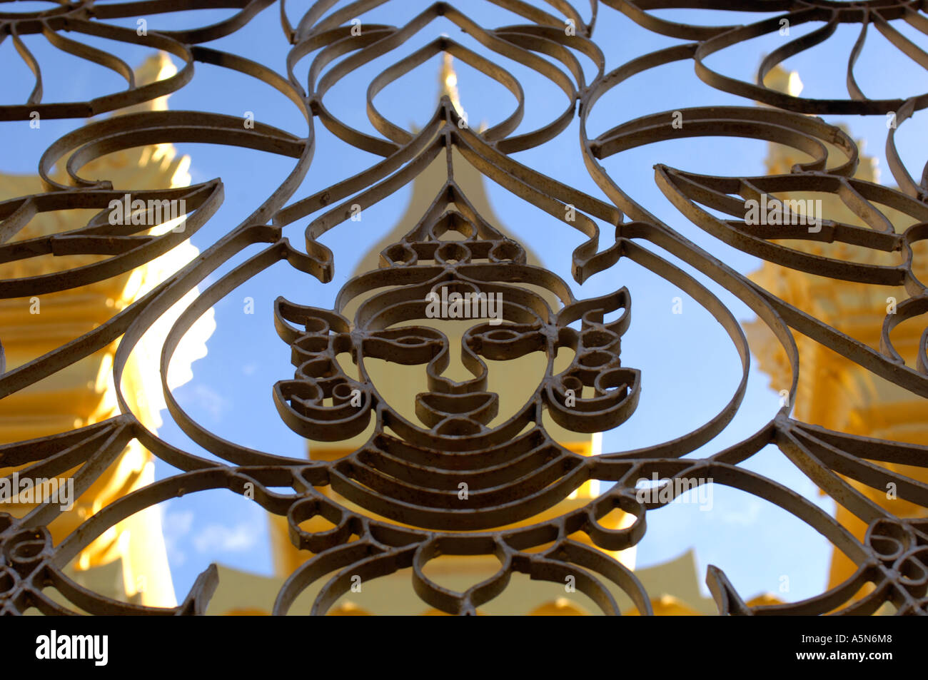 Face in metal gate at Pha That Luang Temple Vientiane Laos Stock Photo ...