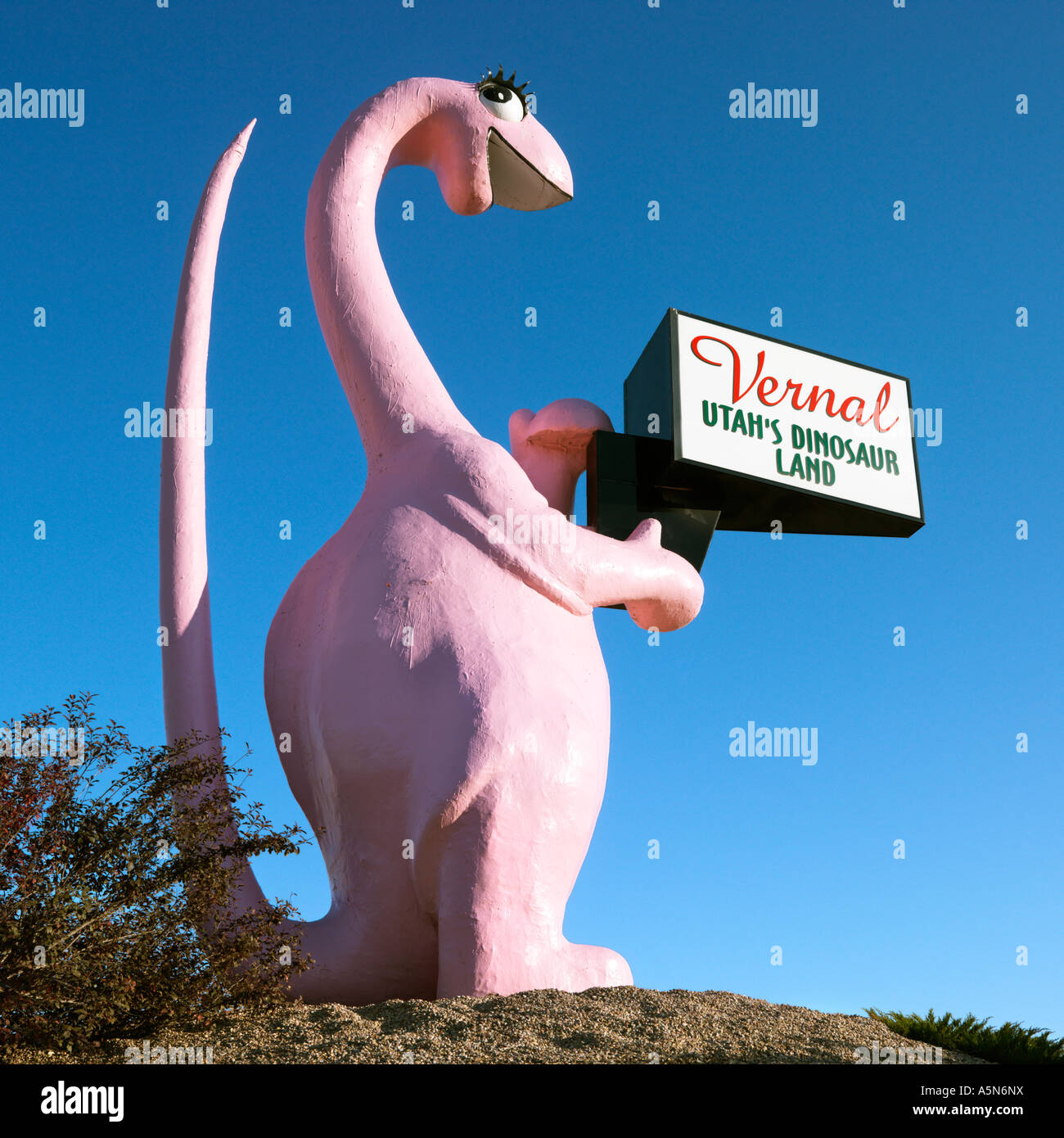 Pink dinosaur holding sign for city of Vernal Utah Stock Photo - Alamy