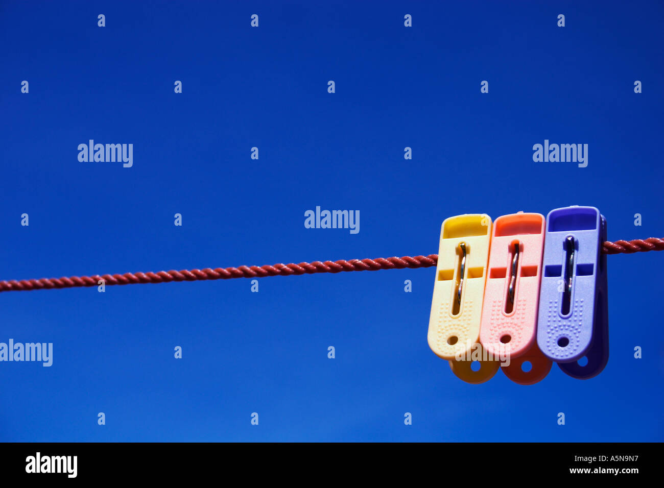 cloth pegs on washing line Stock Photo - Alamy