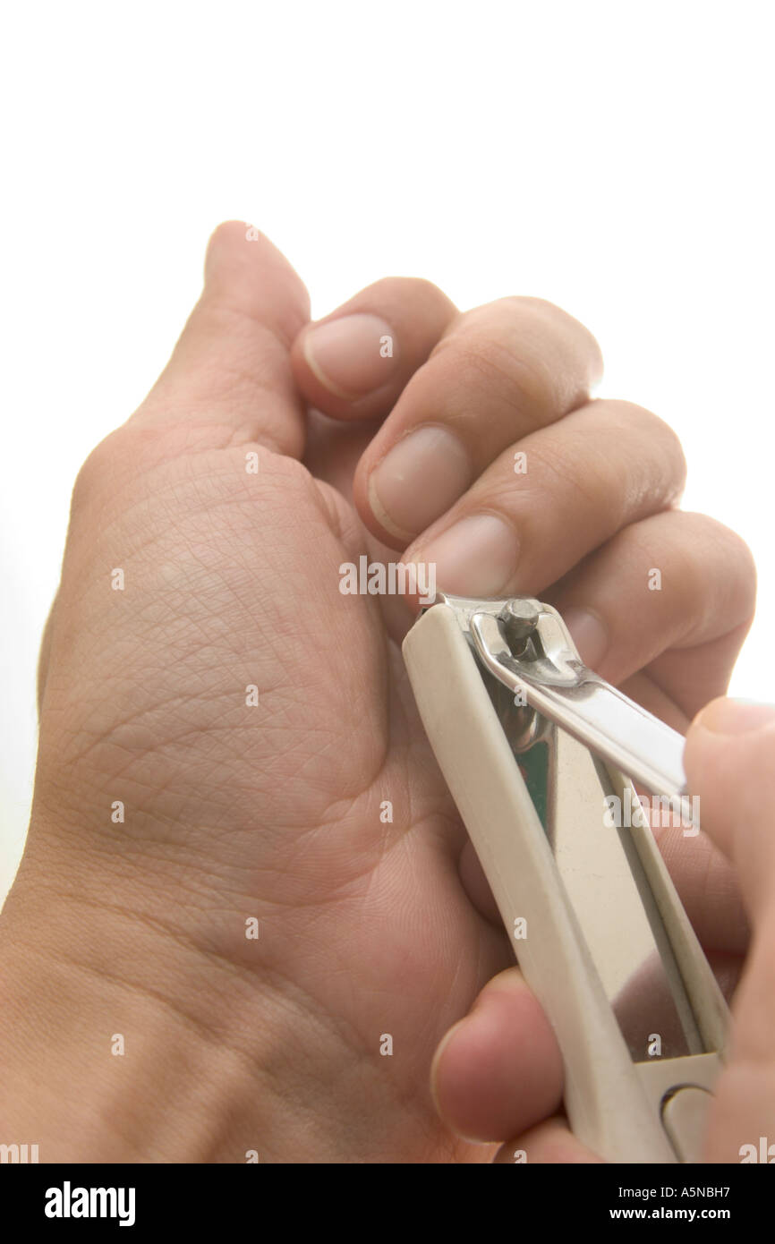 hand cutting fingernails Stock Photo - Alamy