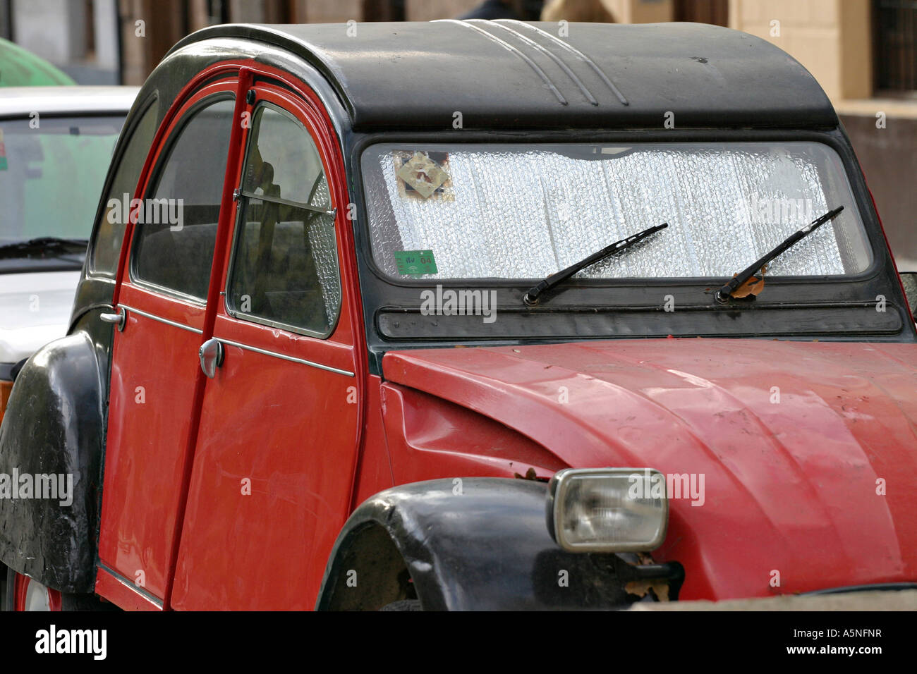 Well Maintained An old 1960s era red Citroen 2CV with a sun screen up ...