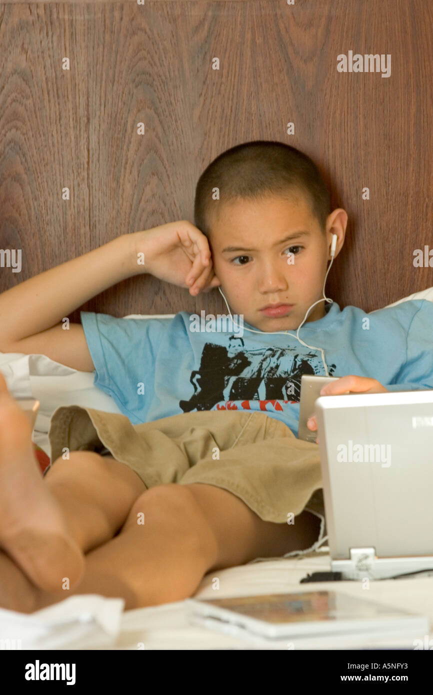 boy watching portable dvd player Stock Photo - Alamy
