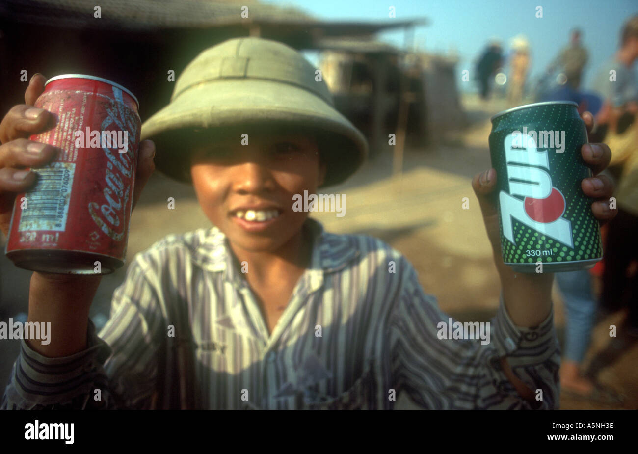 CHILD DISPLAYS PEPSI AND 7UP NORTH VIETNAM Stock Photo - Alamy
