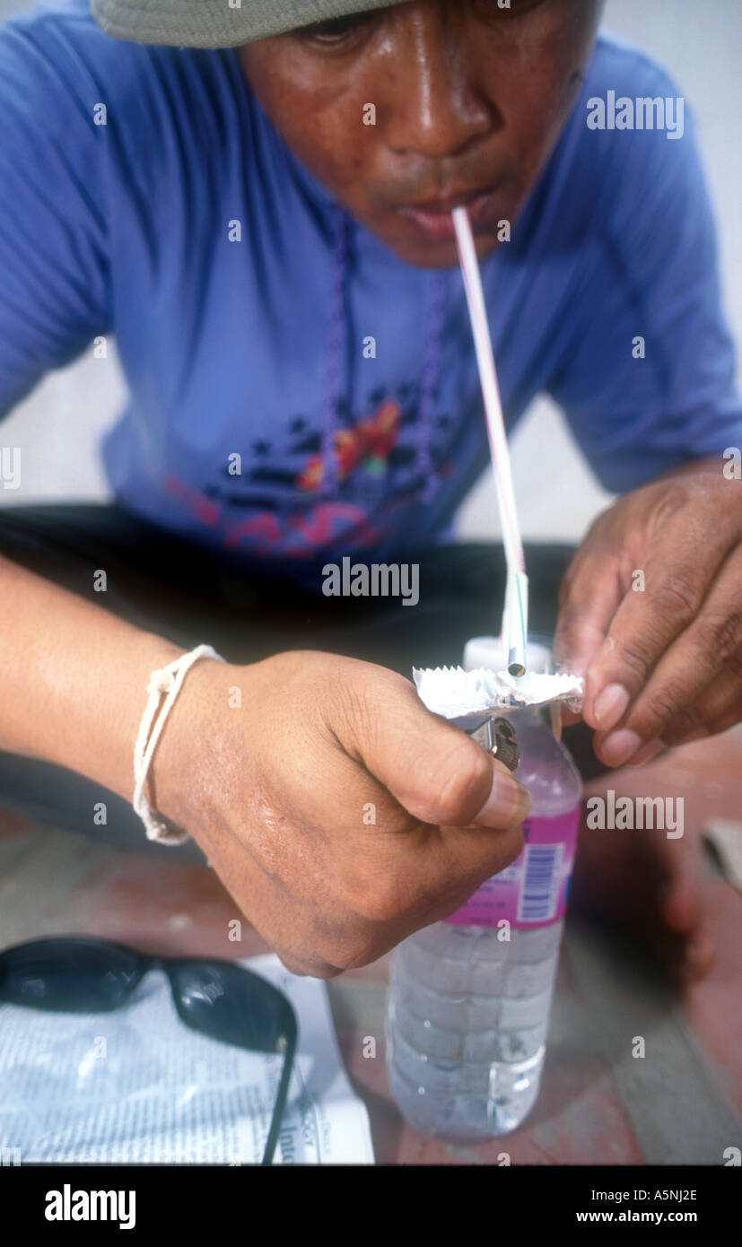 ADDICT SMOKES YABAA THE CRAZY DRUG THAILAND Stock Photo - Alamy