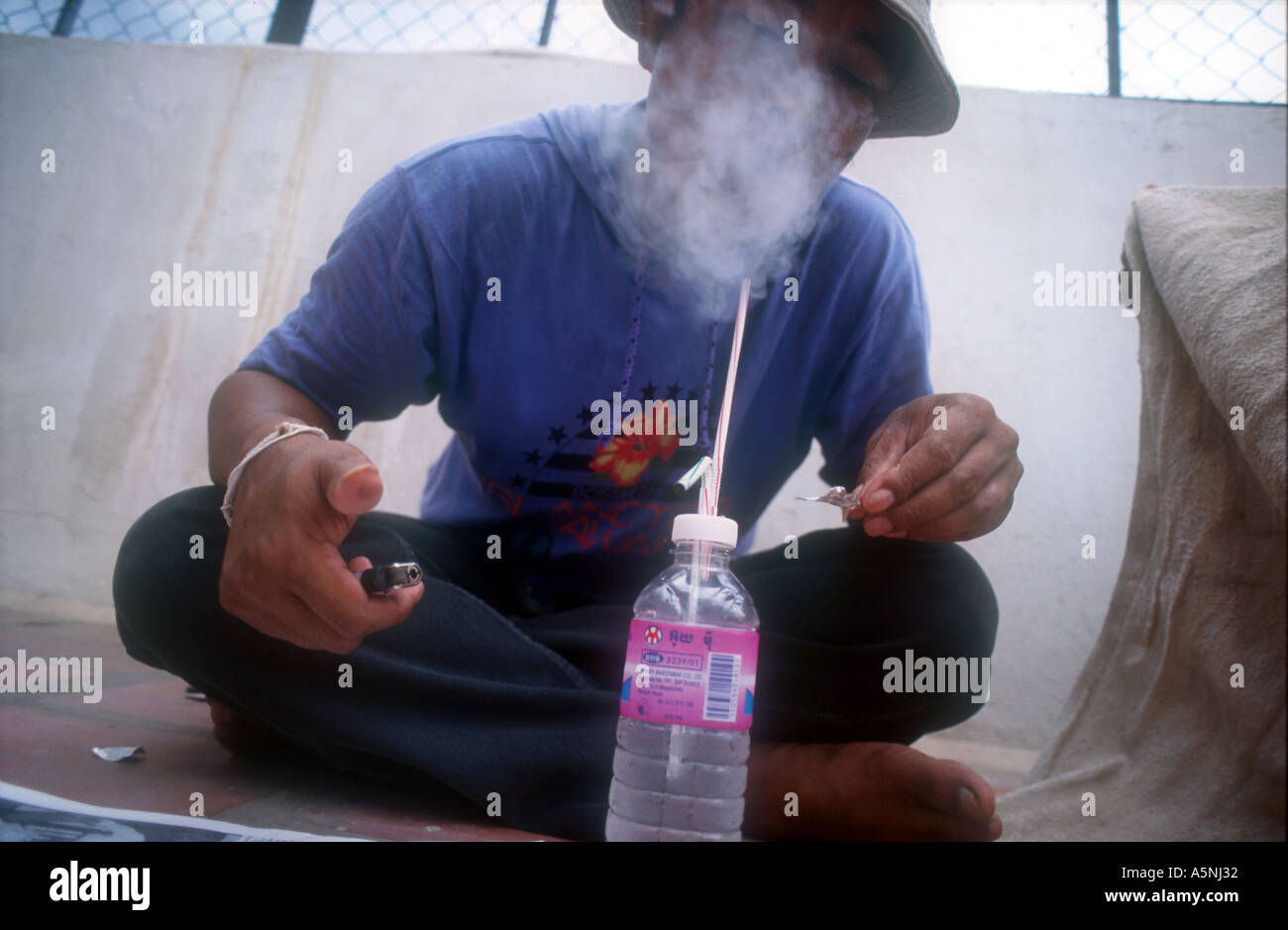 ADDICT SMOKES YABAA THE CRAZY DRUG THAILAND Stock Photo - Alamy