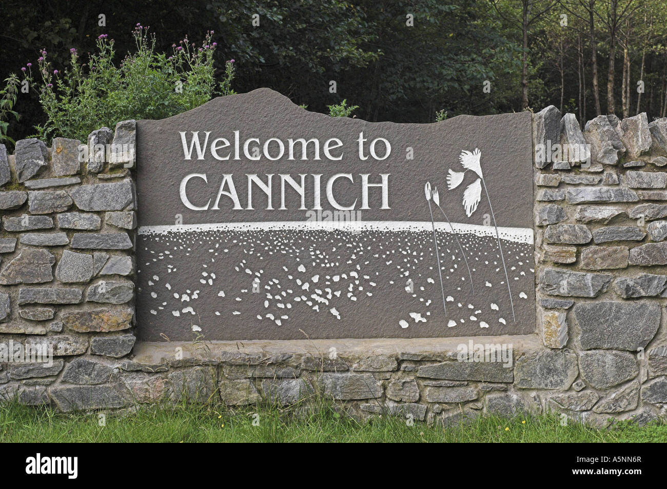 A stone 'Welcome' sign outside Cannich village in the Highland region ...