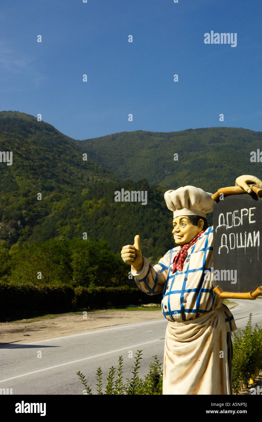 Chef mannequin holding tavern sign in Rodopi mountains Bulgaria East ...