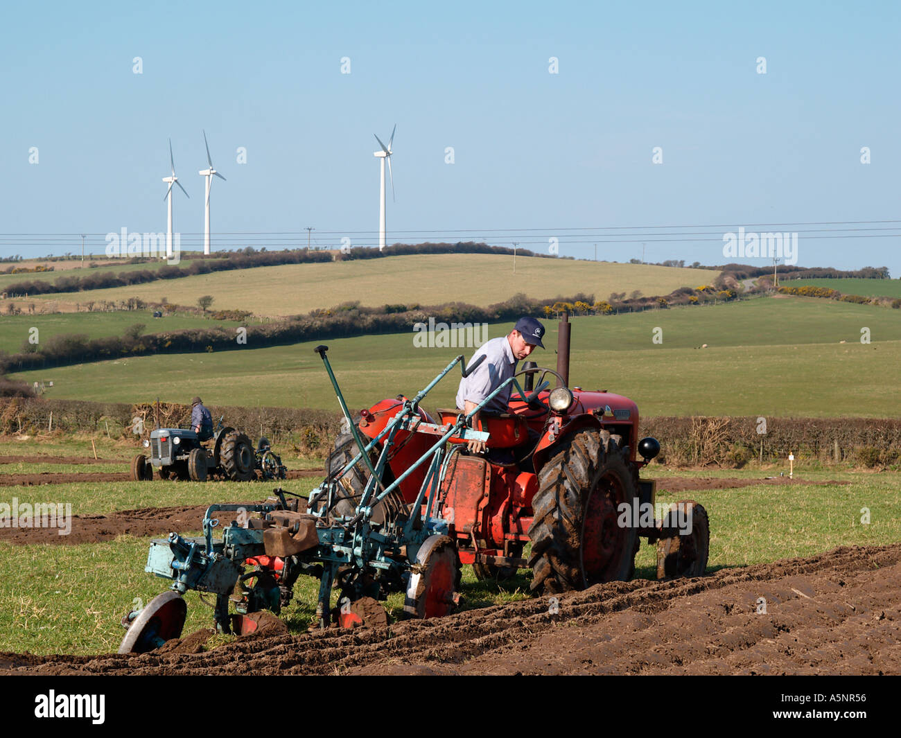 Driver on old tractor with plough cutting new row at Anglesey Vintage ...