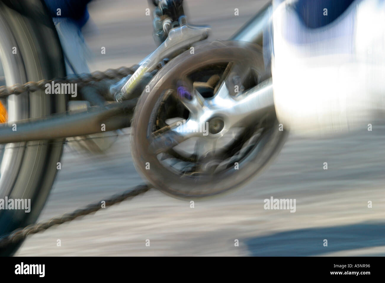 Panned image of child pedalling bicycle Stock Photo - Alamy