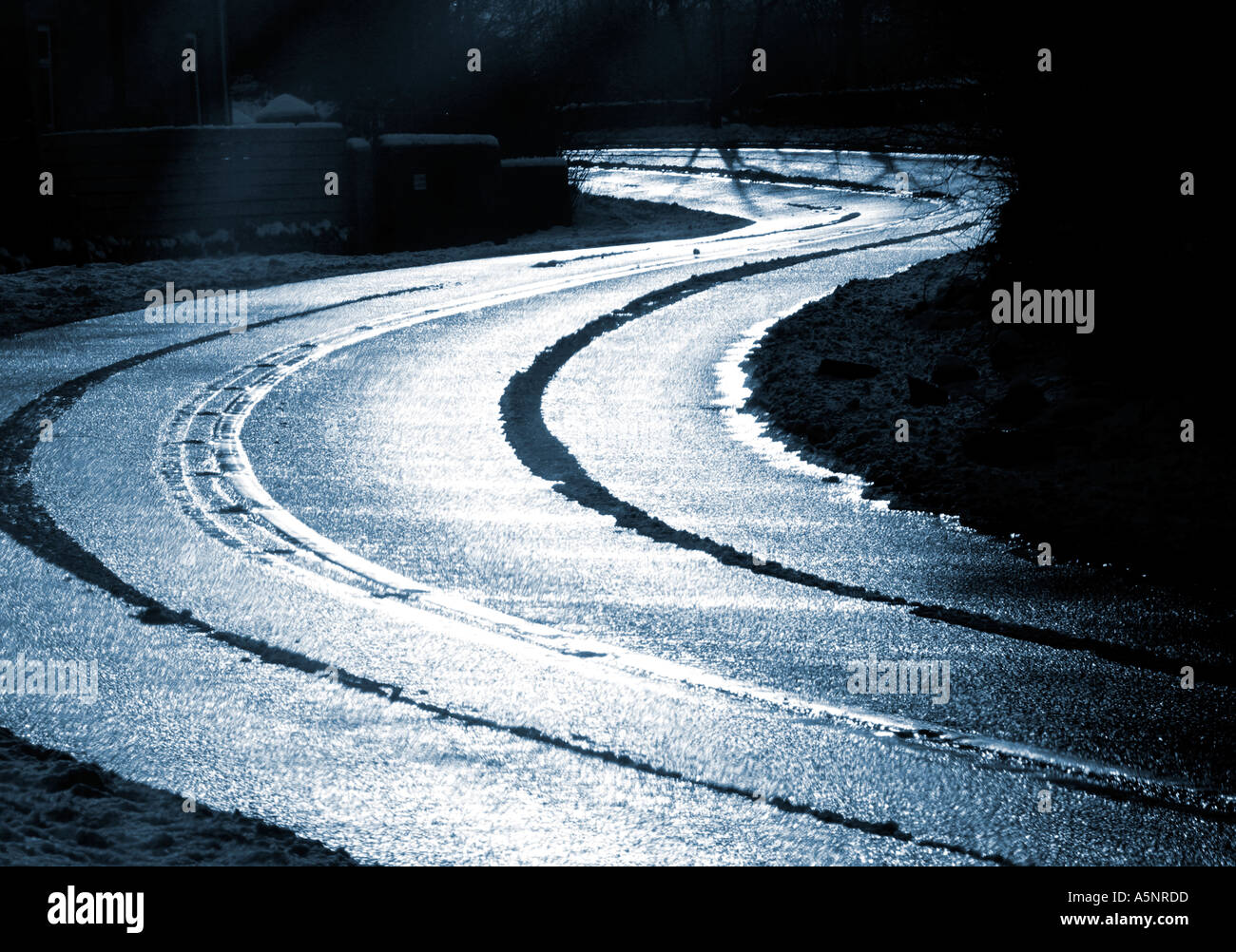 Concept image of rural road winding and twisting round corner shot into ...