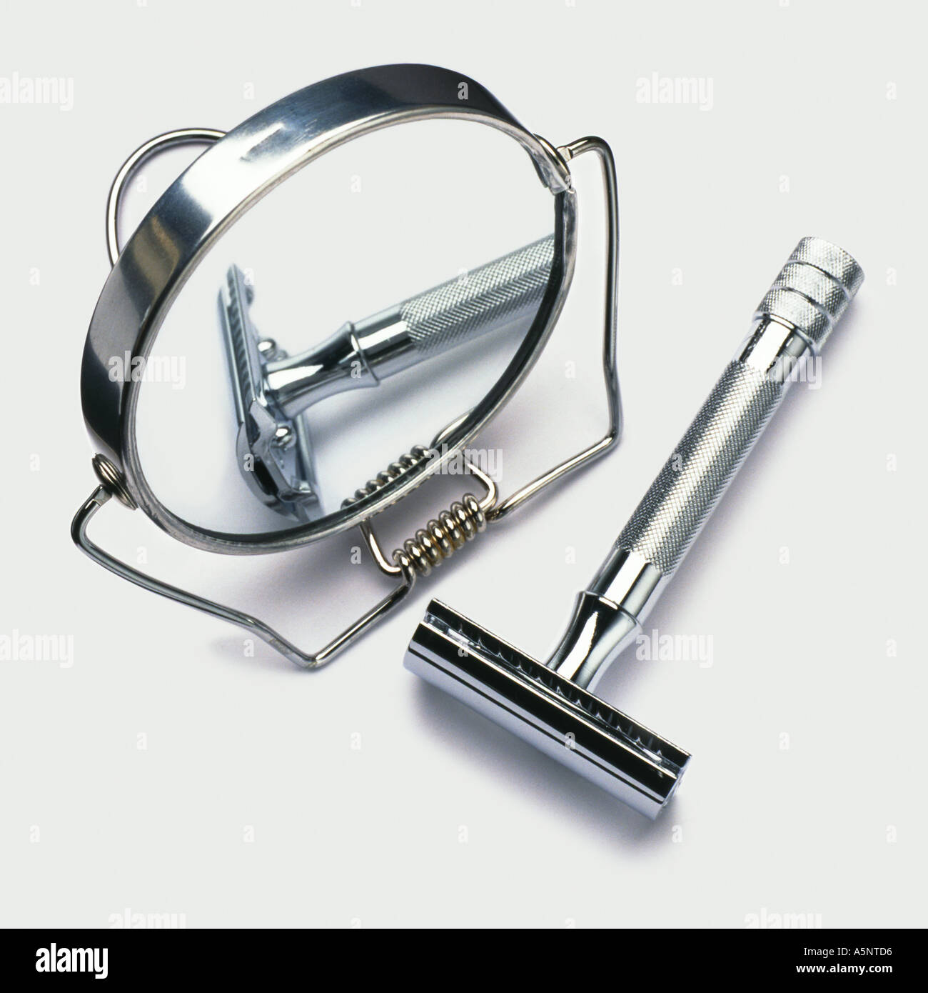 A face mirror and razor Stock Photo - Alamy