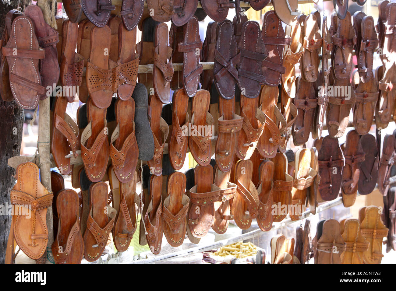 Street scene Baga Goa India leather shoes on sale at local craft stall ...