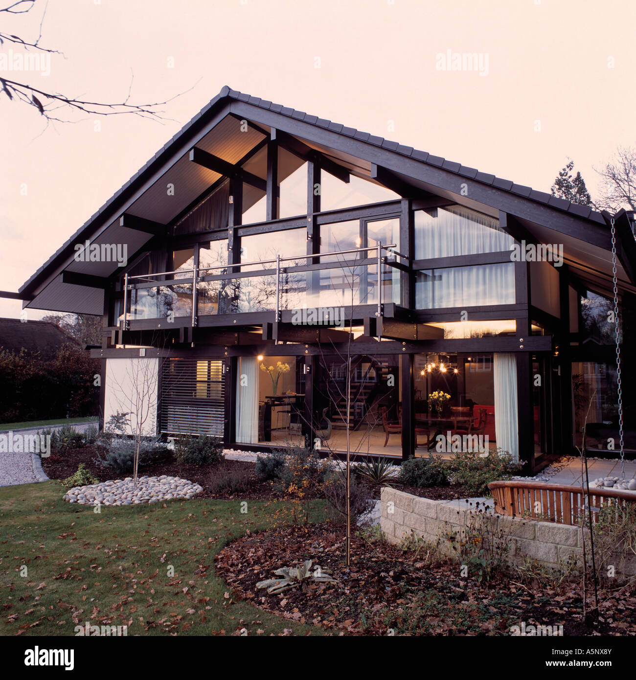 Modern chalet with balcony and doors open Stock Photo - Alamy