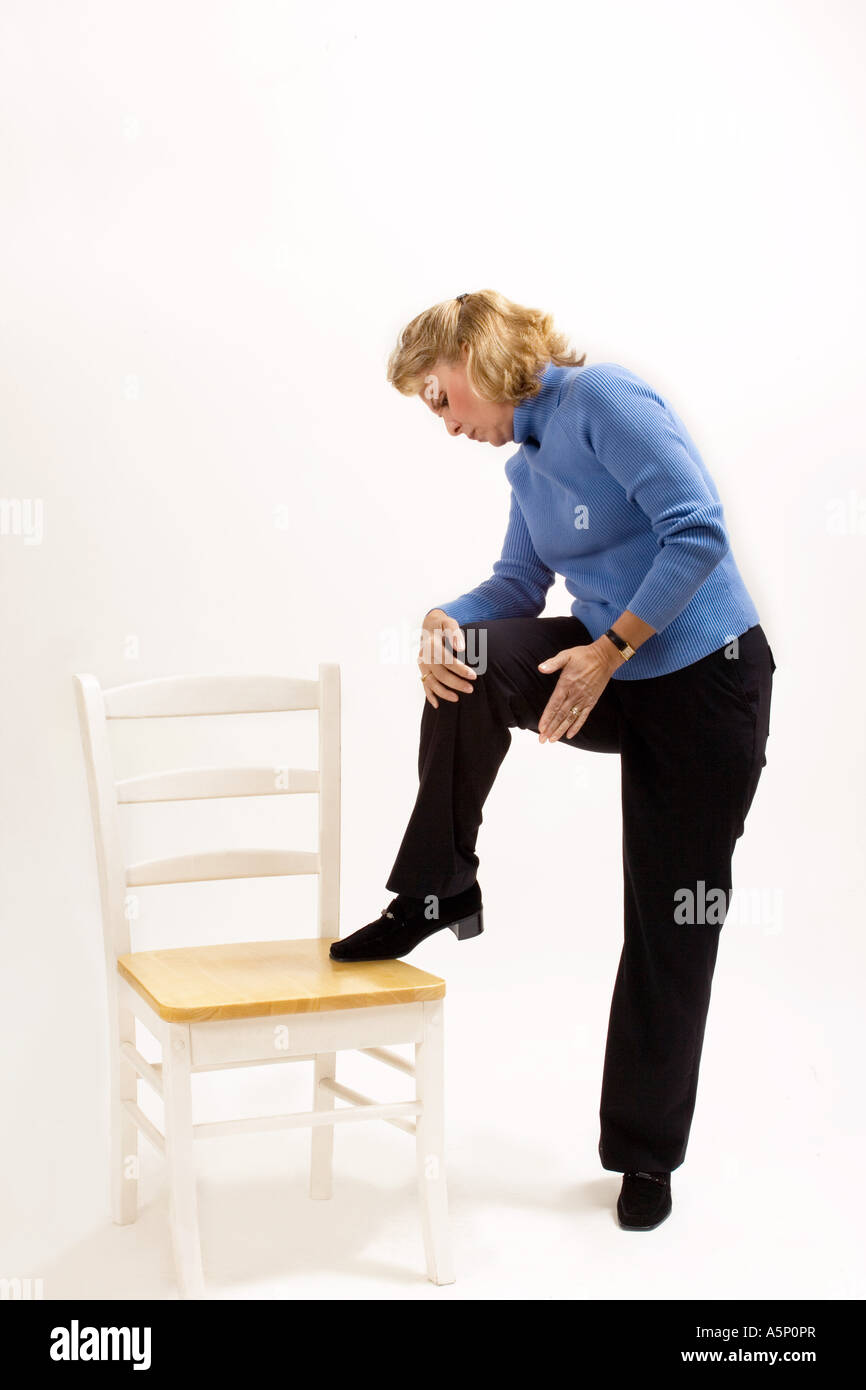 Middle aged woman experiencing leg pain Stock Photo - Alamy