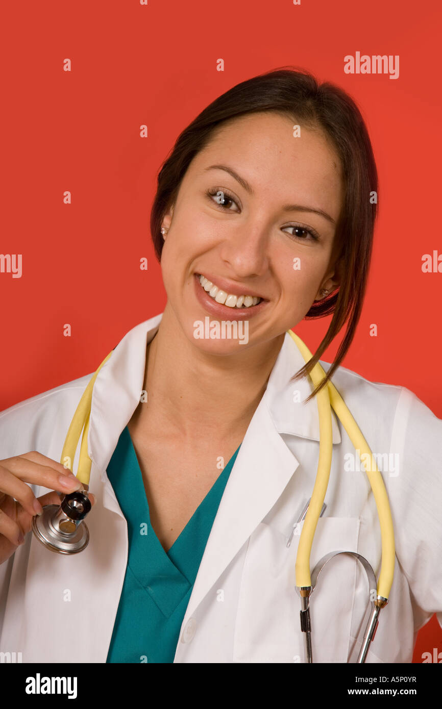 Hispanic female doctor smiling, portrait. Played by a model Stock Photo ...