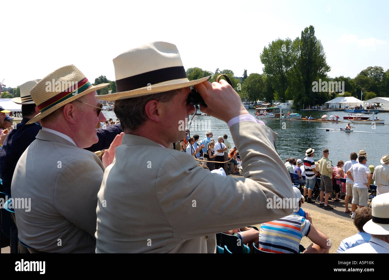 Spectators watching the sculls racing from the Regatta Enclosure at the ...