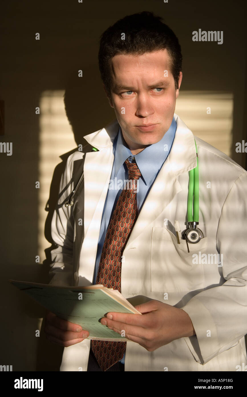 Doctor stands in front of dramatic lighting area Stock Photo - Alamy