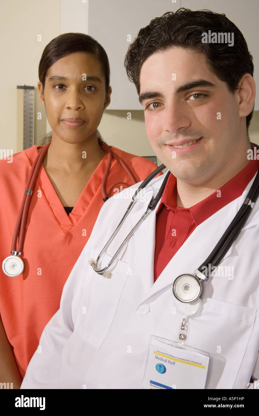 Nurse and doctor portrait together in the medical office Stock Photo ...