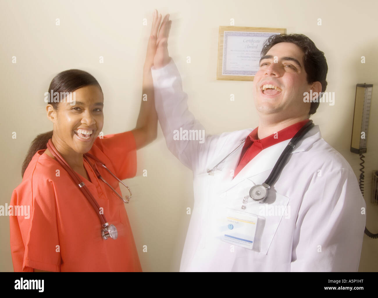 Doctor and nurse high five each other. Yeessss! Stock Photo - Alamy