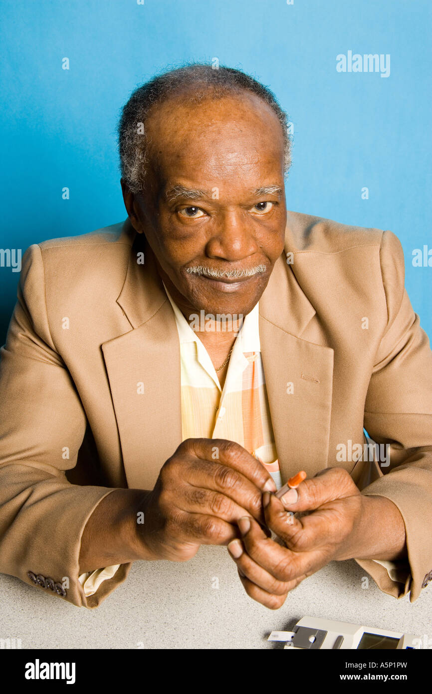 Man with diabetes prepares needle and insulin medication Stock Photo ...