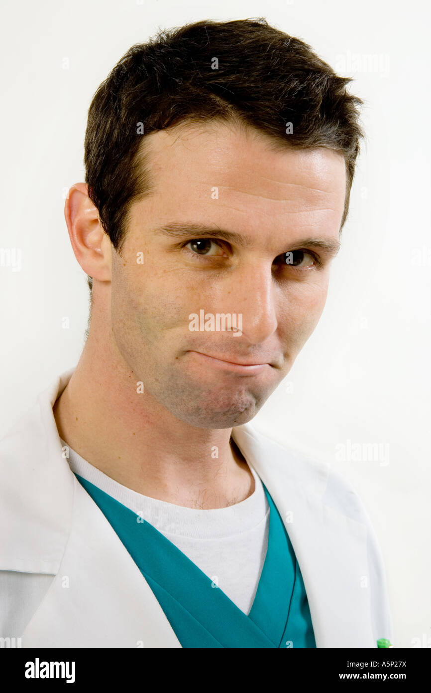 Male healthcare worker smiles (or smirks) for the camera Stock Photo ...
