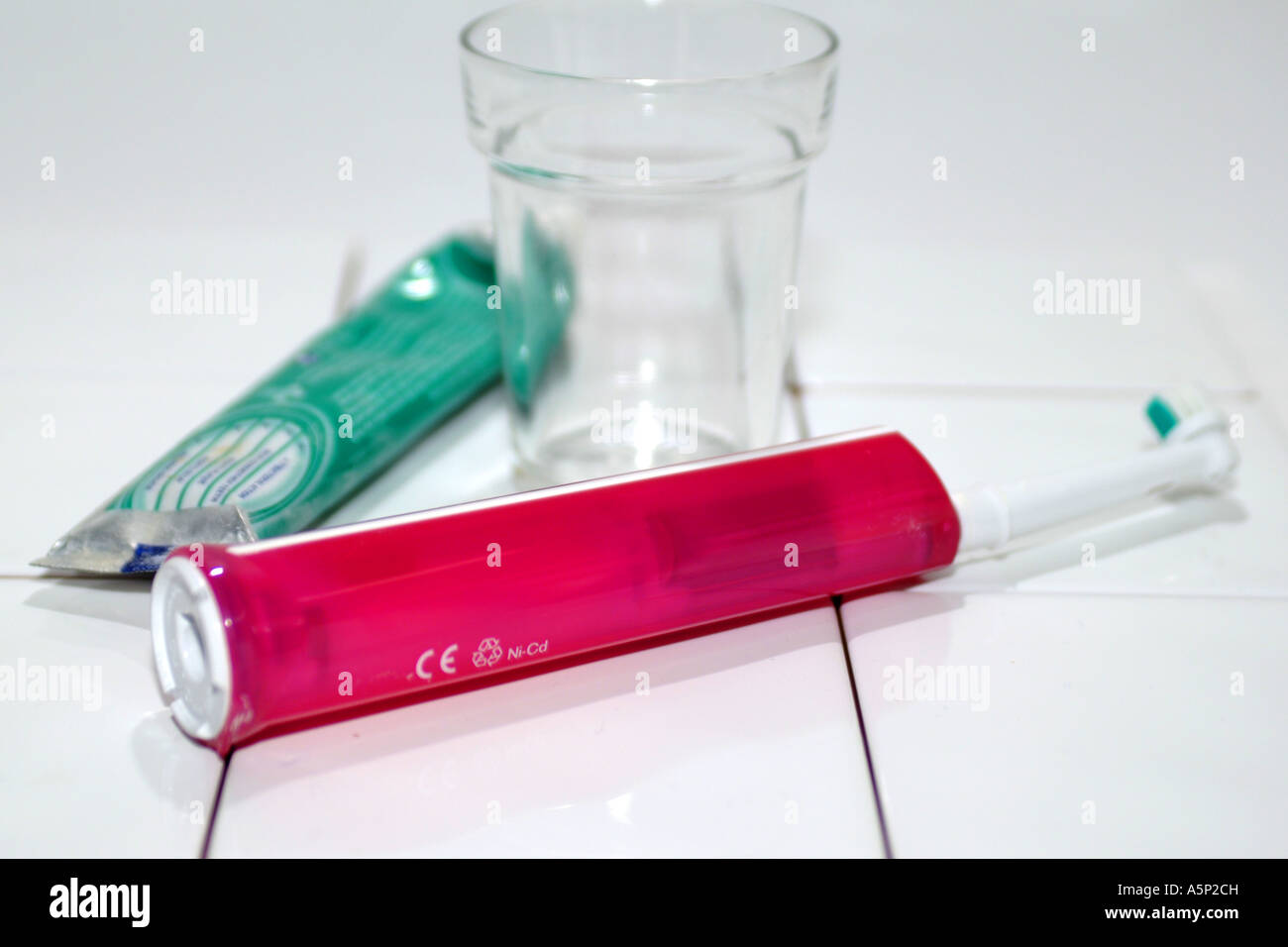 Red Electric Toothbrush Stock Photo - Alamy