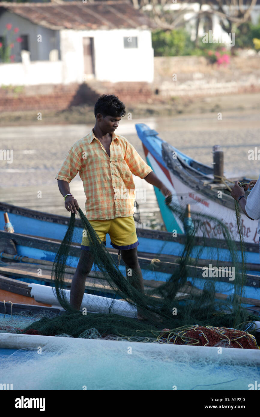 Local commercial fishermen landing their catch on Baga beach Goa India ...