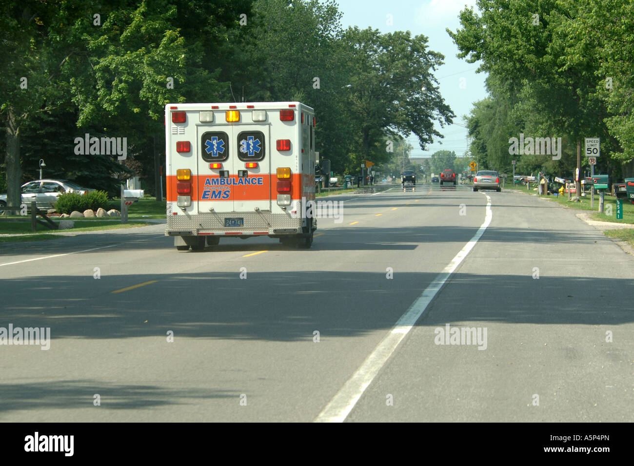 An American Ambulance speeding along a US Highway in Michigan Stock ...