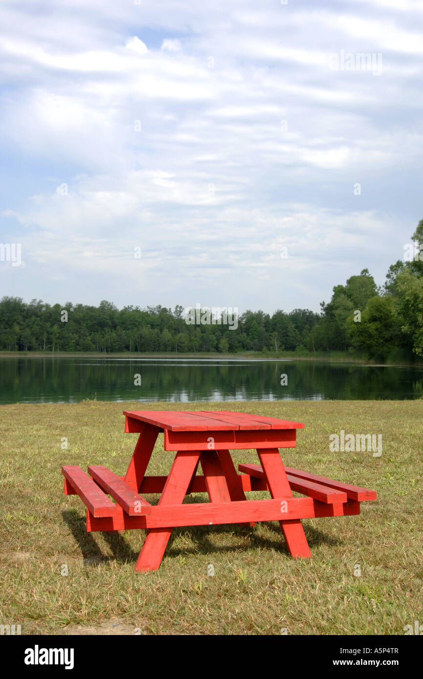 A red painted wooden park bench table Stock Photo - Alamy