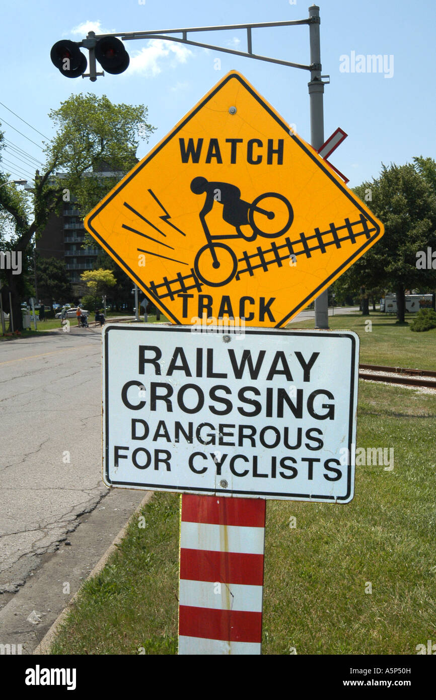 Caution sign Railroad Crossing dangerous for cyclists Stock Photo - Alamy