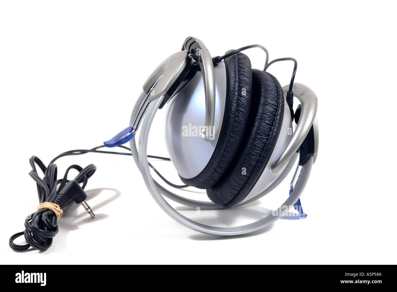 A set of Silver colored headphones against a white background Stock ...