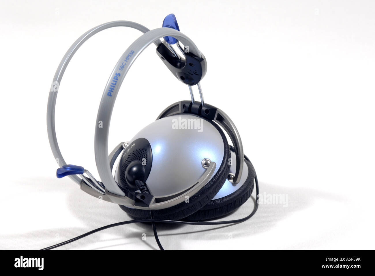 A set of Silver colored headphones against a white background Stock ...