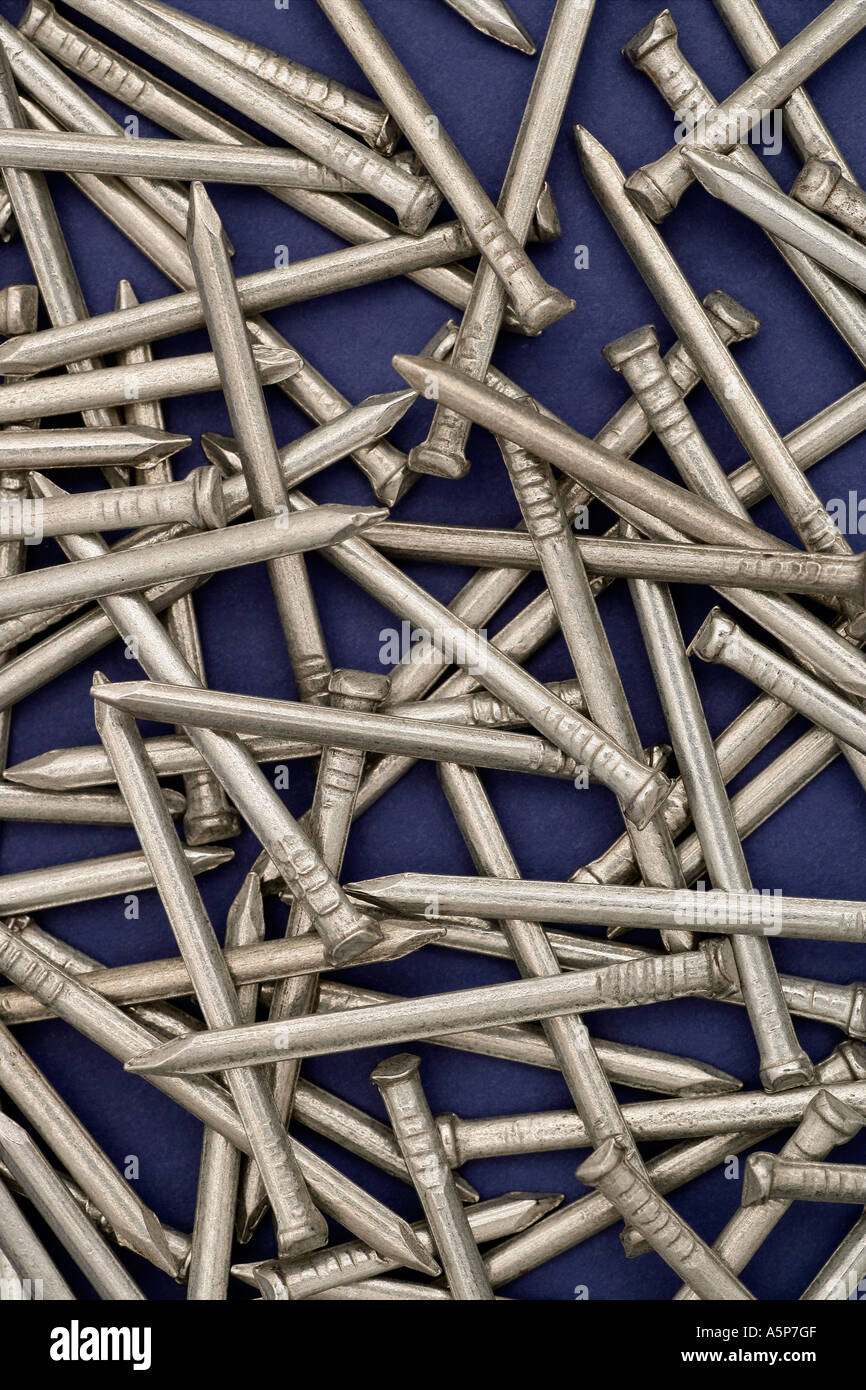 Wire Nails on Blue Background Stock Photo - Alamy