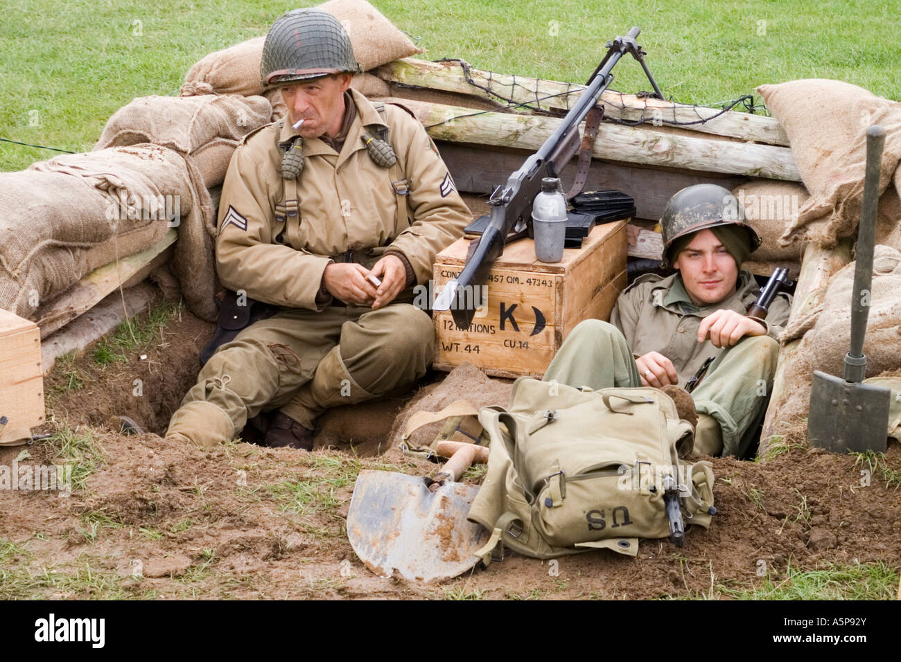 US Army Corporal With Cigarette & Private in Dugout WW2 Stock Photo - Alamy