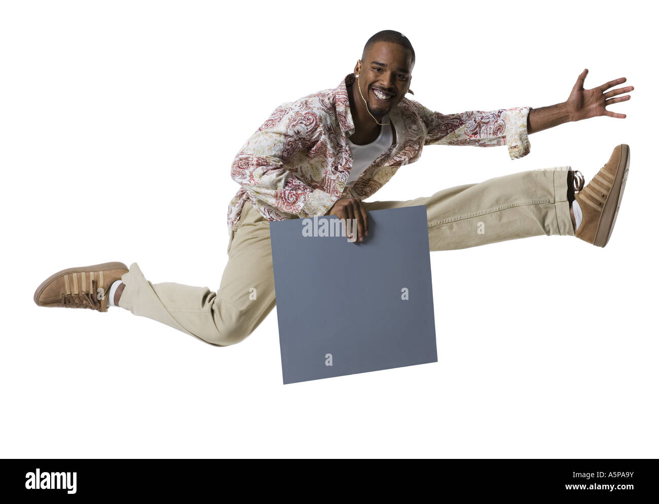 African American man jumping and holding a blank sign Stock Photo - Alamy