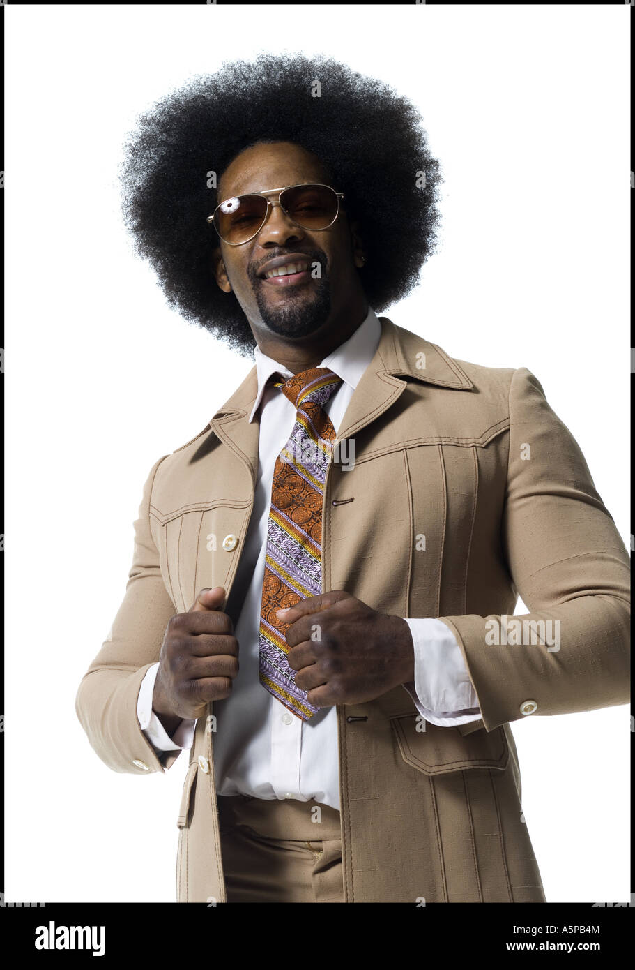 Man with an afro in beige suit Stock Photo - Alamy