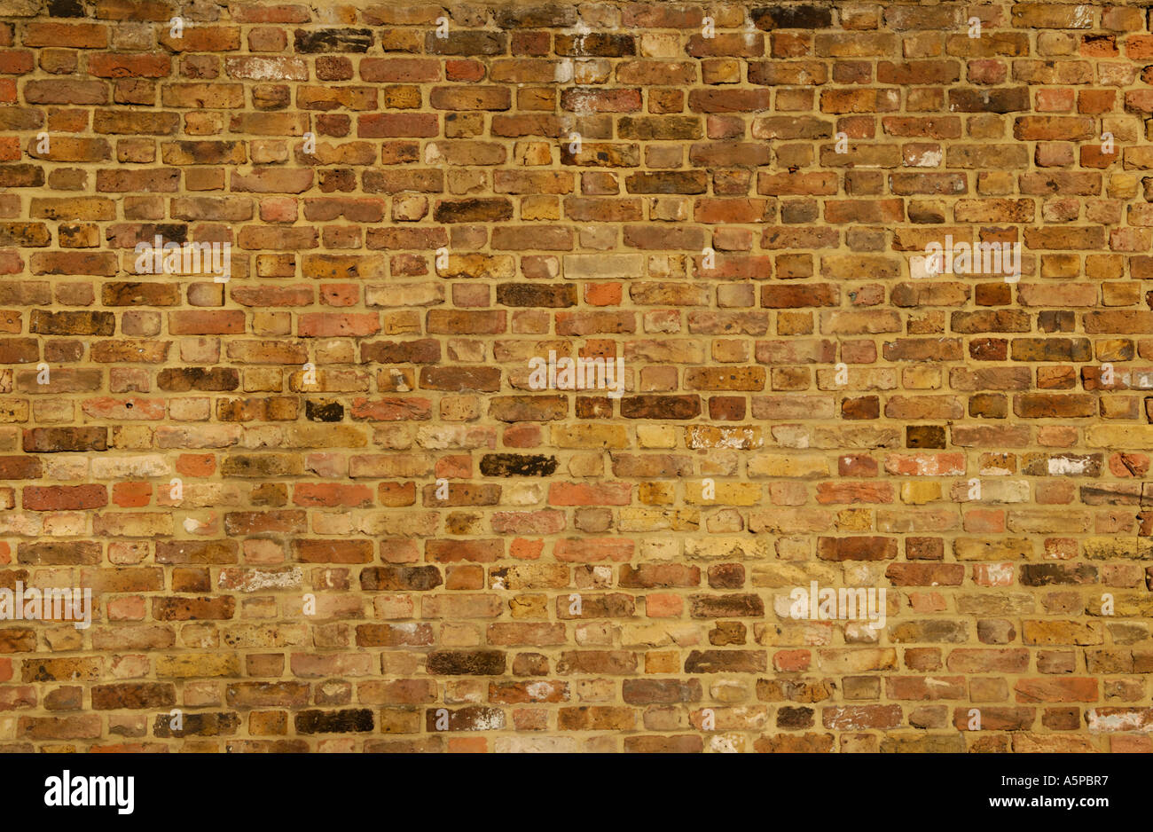 Yellow Red brick wall Stock Photo - Alamy