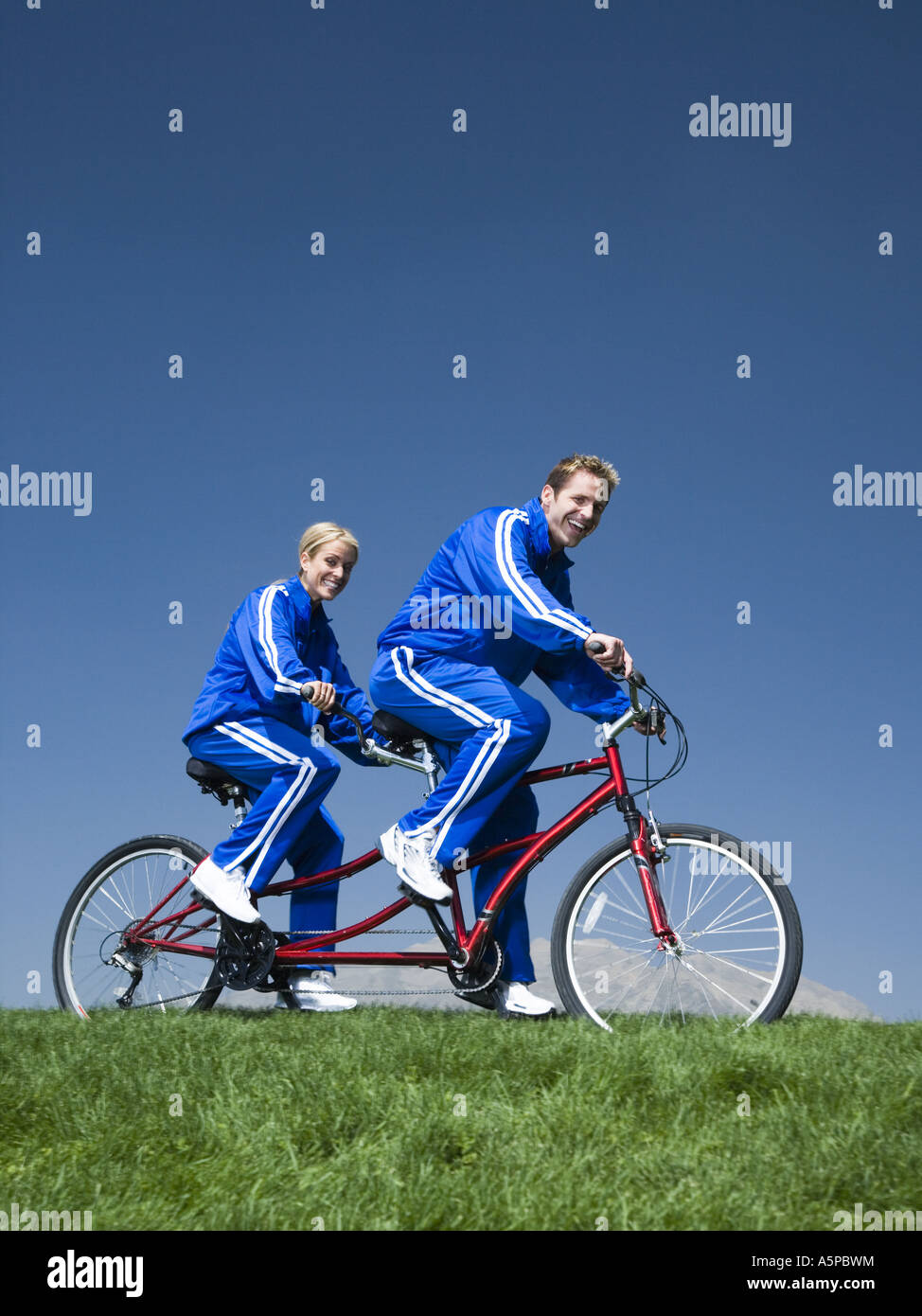 Family riding a tandem bicycle hi-res stock photography and images - Alamy