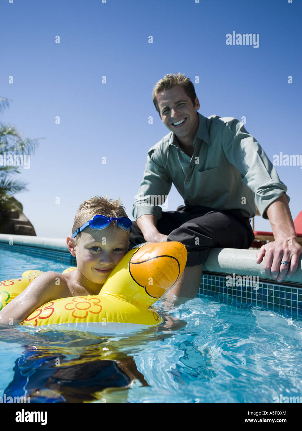 Father and son at swimming pool Stock Photo - Alamy